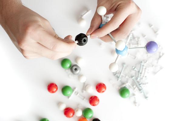 Free Stock image of Man constructing a 3d chemistry molecule model ...
